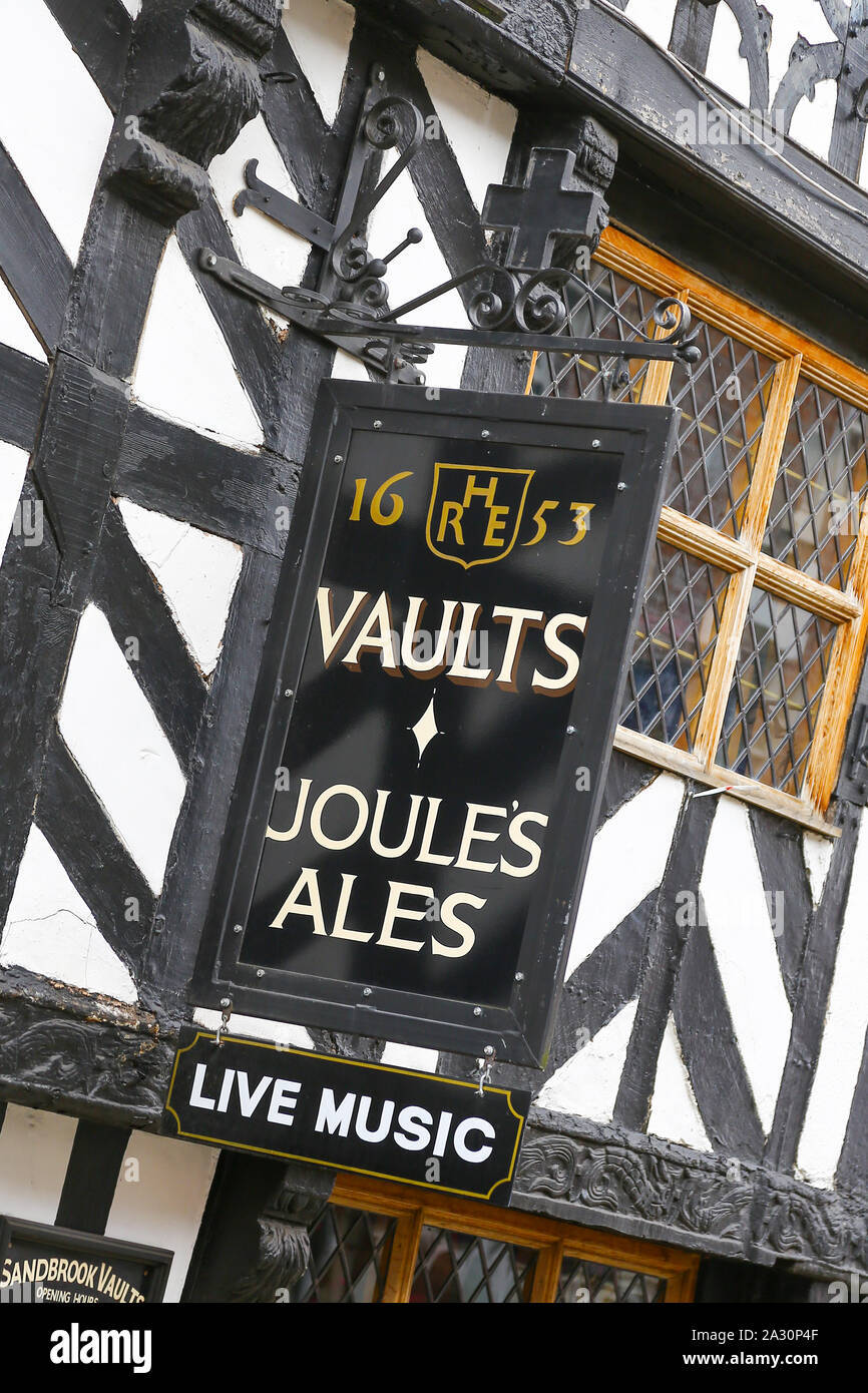 A sign outside the The Sandbrook Vaults pub or public house, a Grade II ...
