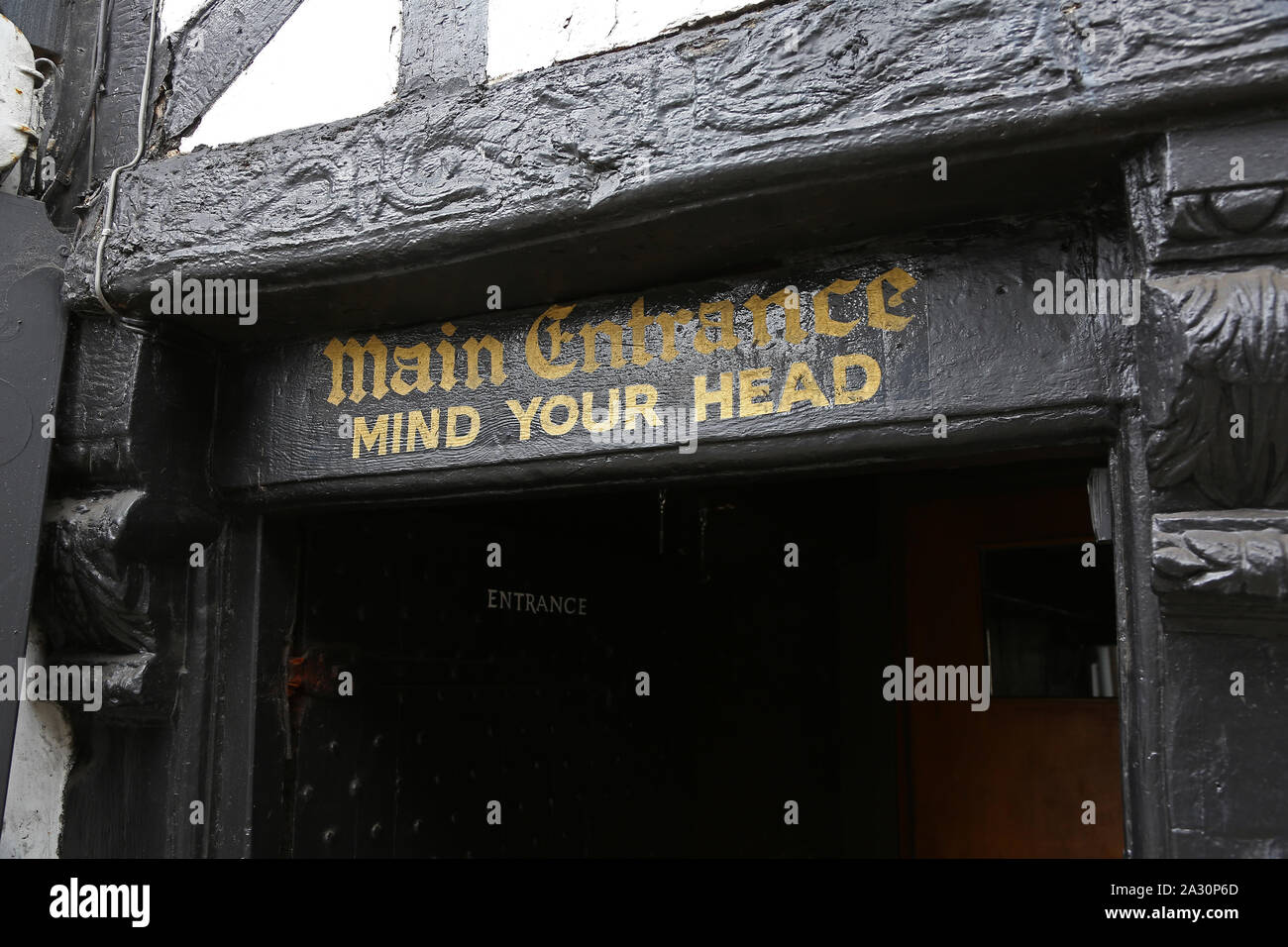 A sign above the entrance saying 'mind your head' at The Sandbrook ...