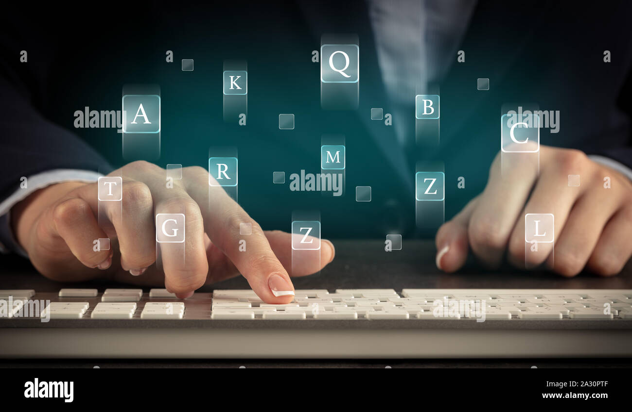 Business woman typing on keyboard with letters around Stock Photo - Alamy