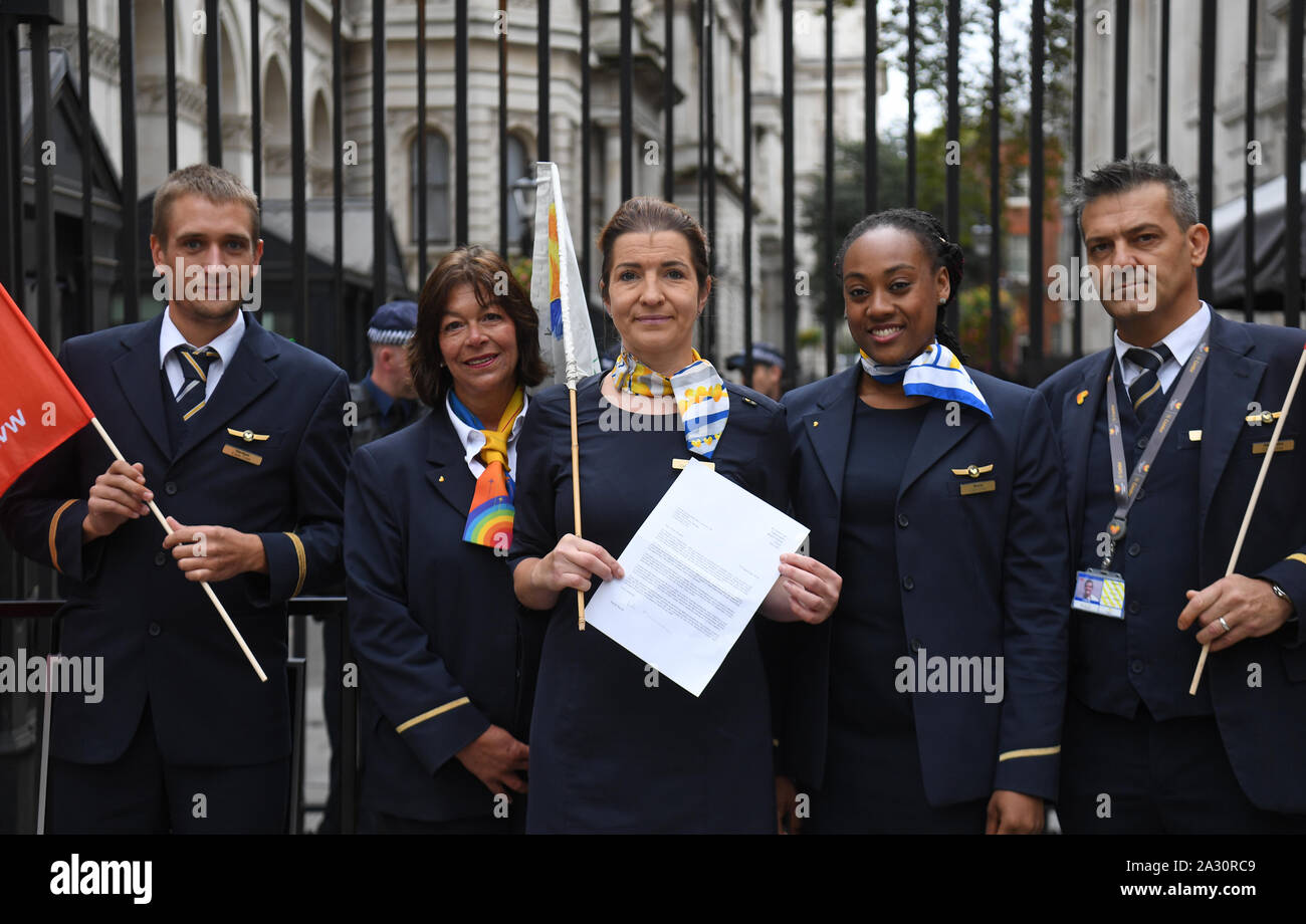 Ex-Thomas Cook cabin crew member Rachel Murrell (centre) holds a letter ...