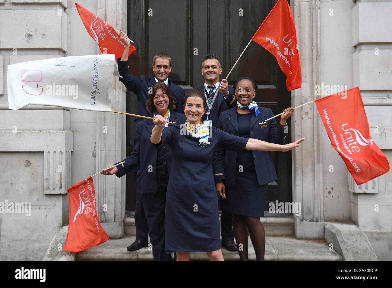 Ex-Thomas Cook cabin crew member Rachel Murrell waves flags with former ...