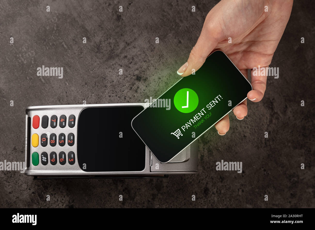 Mobile payment accepted on terminal Stock Photo - Alamy