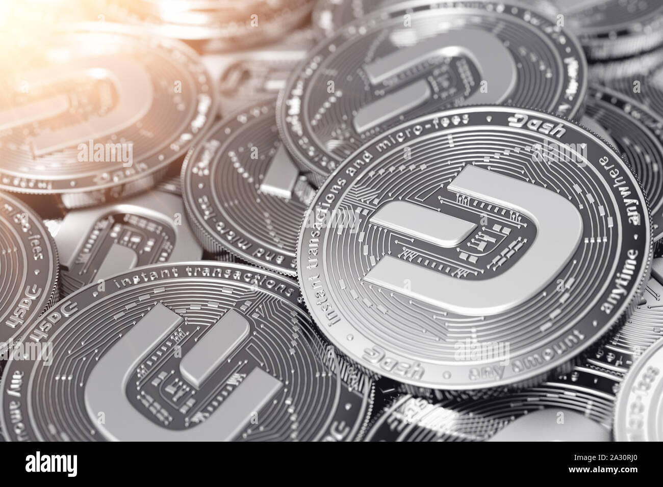 Stack of silver Dash coins (with 2019 updated logo) in blurry closeup ...