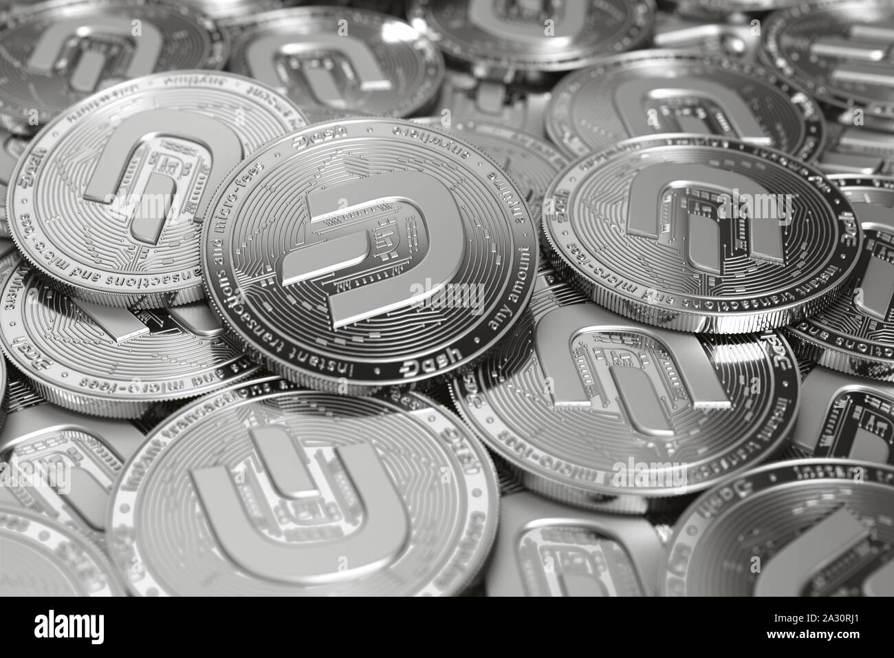 Stack of silver Dash coins (with 2019 updated logo) in blurry closeup ...