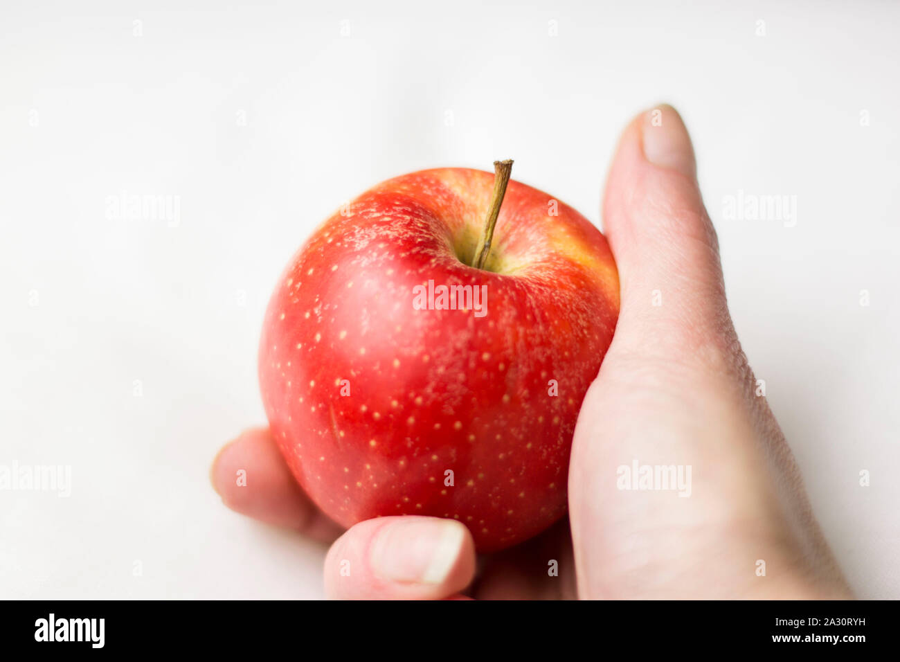 Apple in a hand hi-res stock photography and images - Alamy