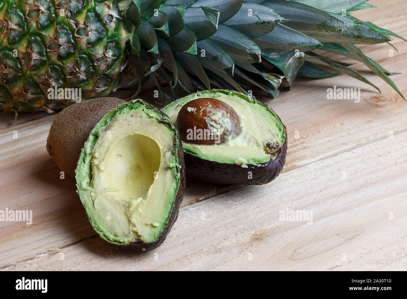Avocado cut in half Stock Photo - Alamy