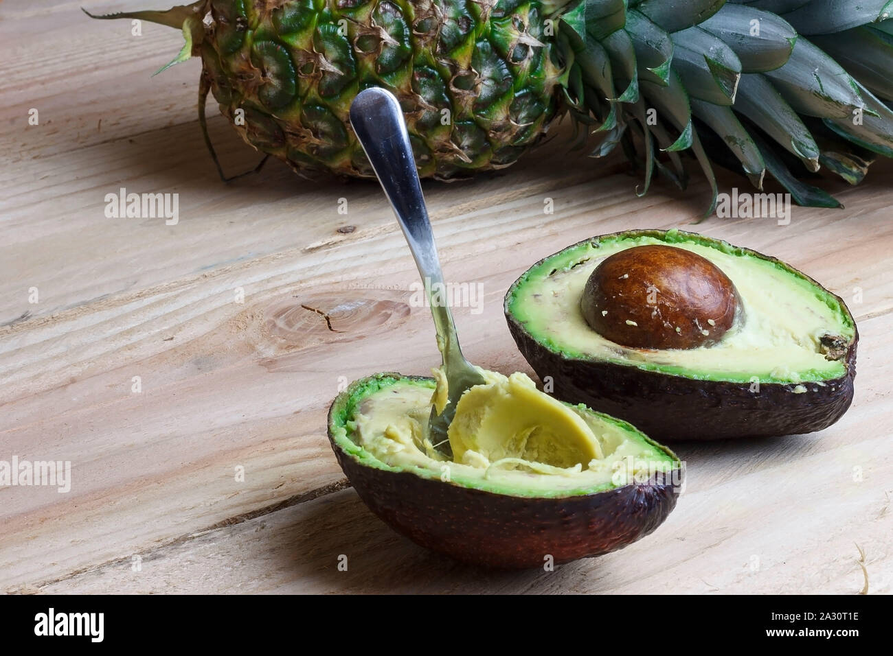 Avocado cut in half Stock Photo - Alamy