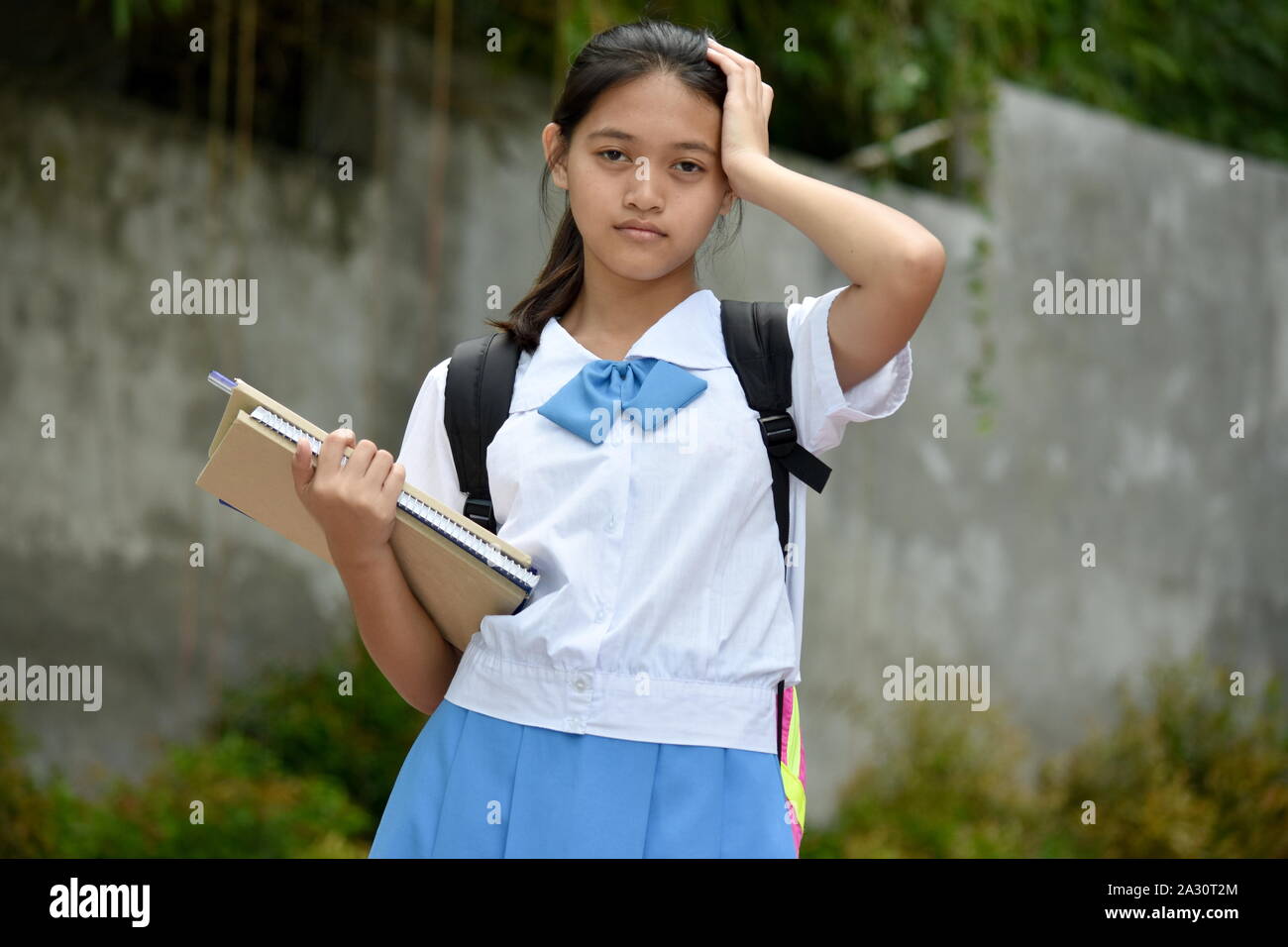 Pretty Asian Female Student Memory Problems Stock Photo - Alamy