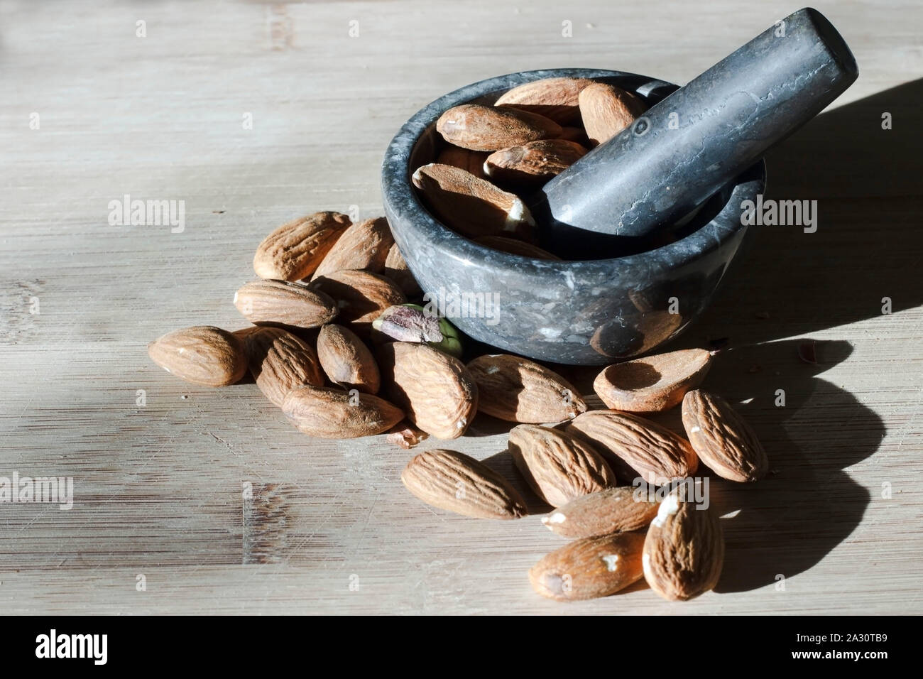 Almonds on table hi-res stock photography and images - Alamy