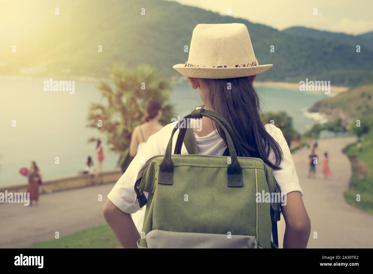 Girl with backpack viewing to the sea during sunset in phuket Stock ...