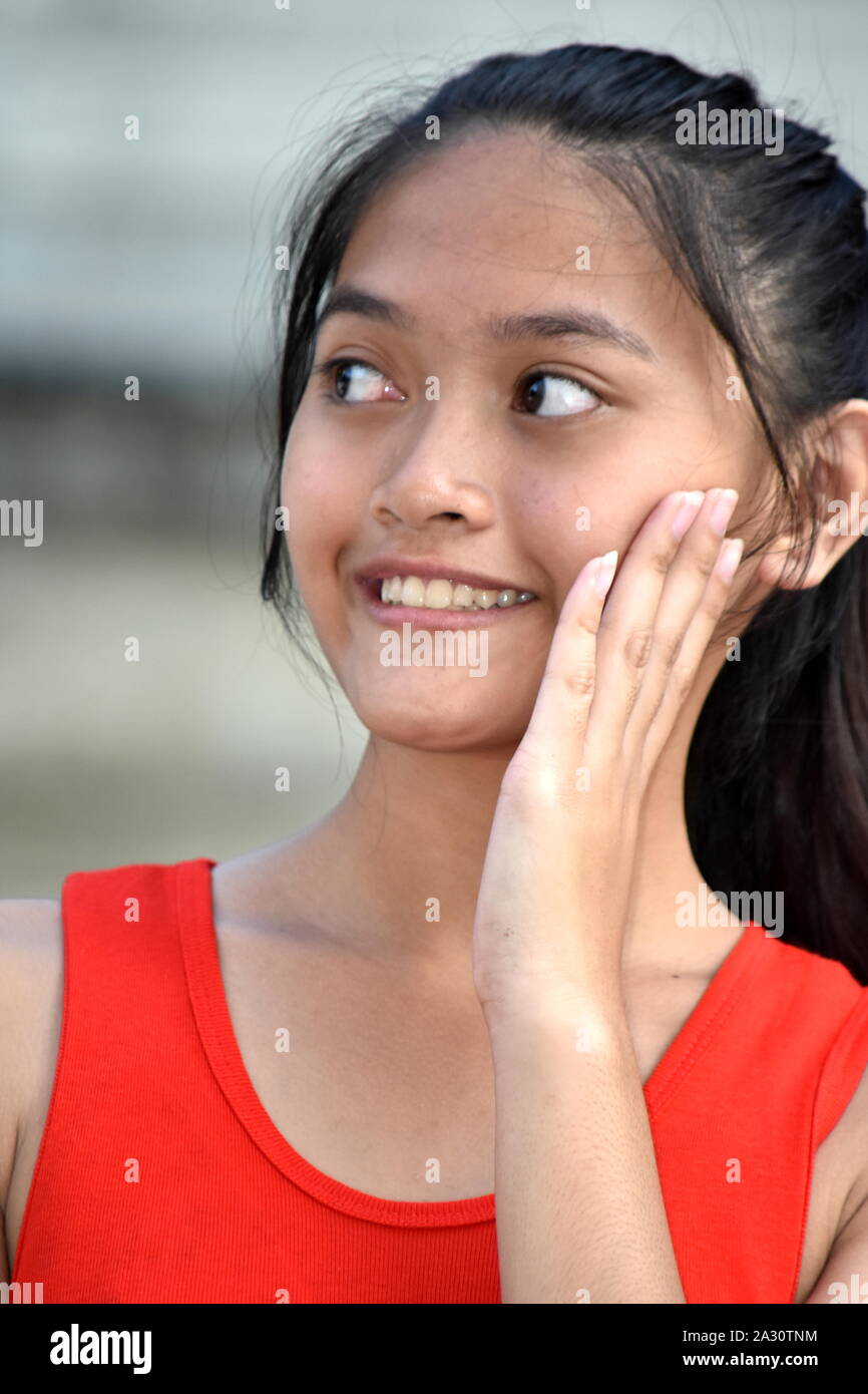 An A Contemplative Female Youngster Stock Photo - Alamy