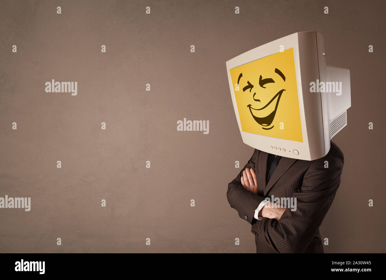 Young person with happy smiley monitor head Stock Photo - Alamy