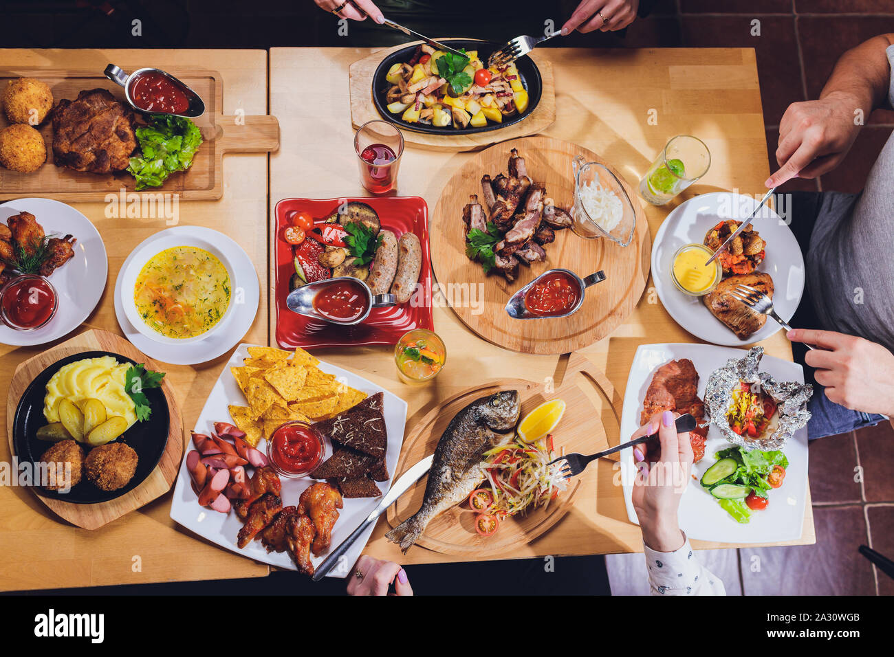 man at the big table with food Stock Photo - Alamy