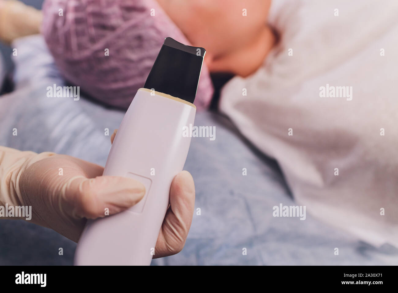 receiving ultrasonic facial exfoliation procedure of ultrasonic ...