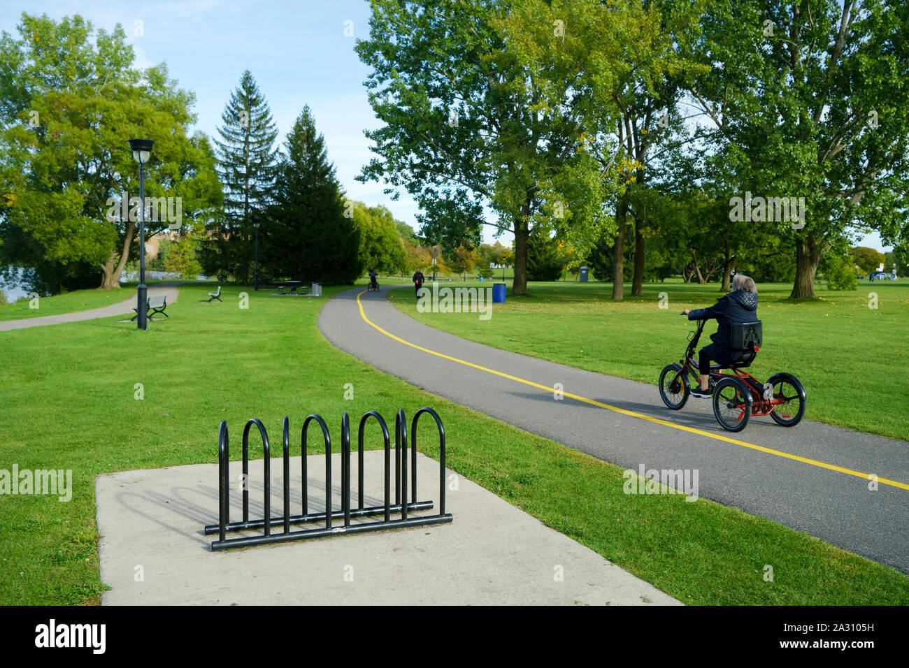 Woman riding tricycle hi-res stock photography and images - Alamy