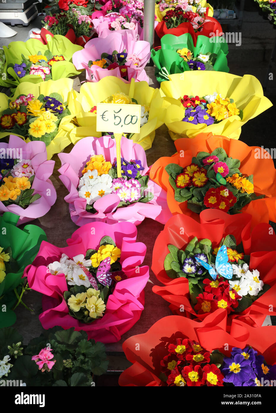 bouquets of colorful flowers for sale in the florist's stall with the ...