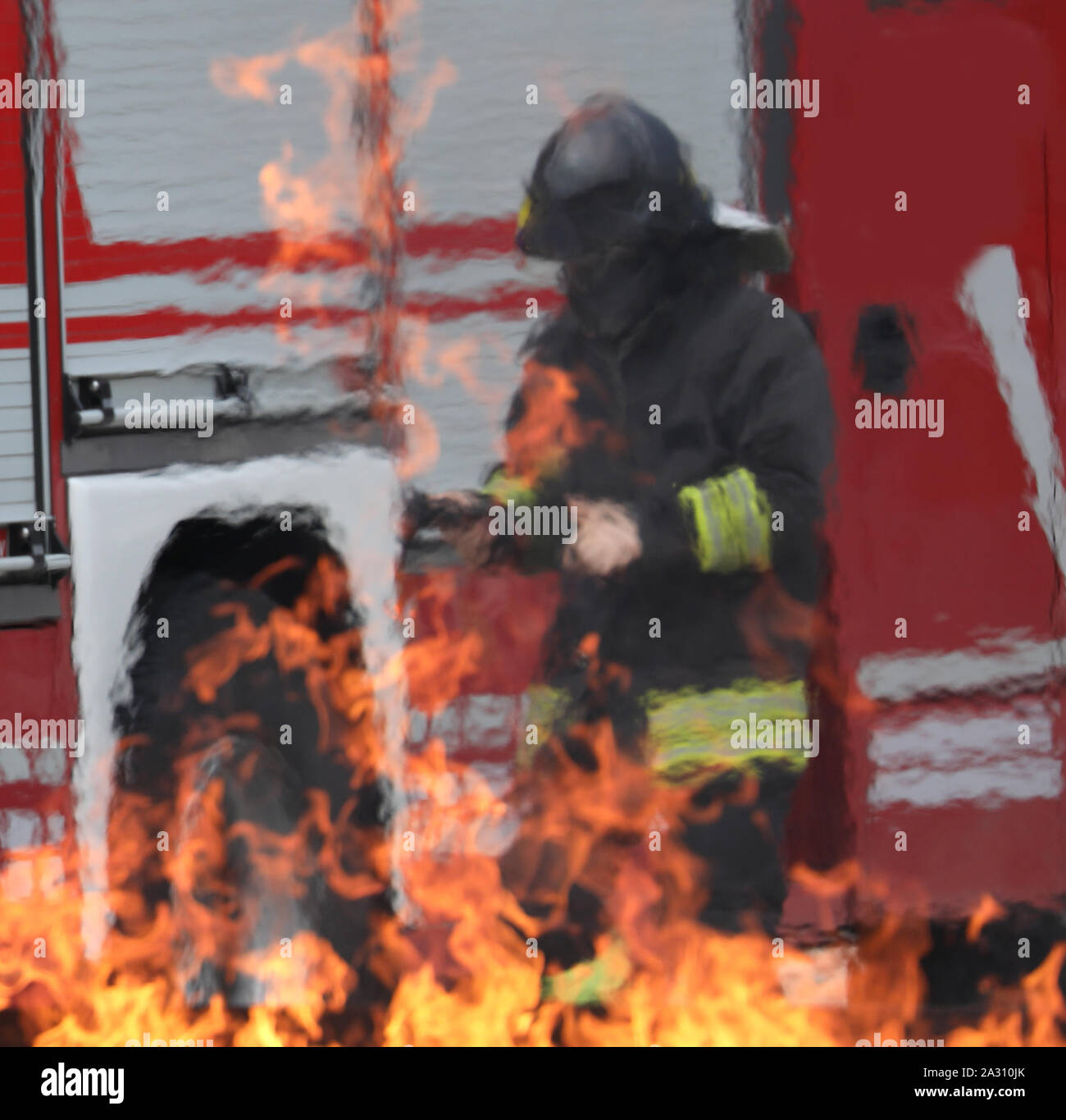 firefighter and the hot flame of the fire during the drill Stock Photo ...