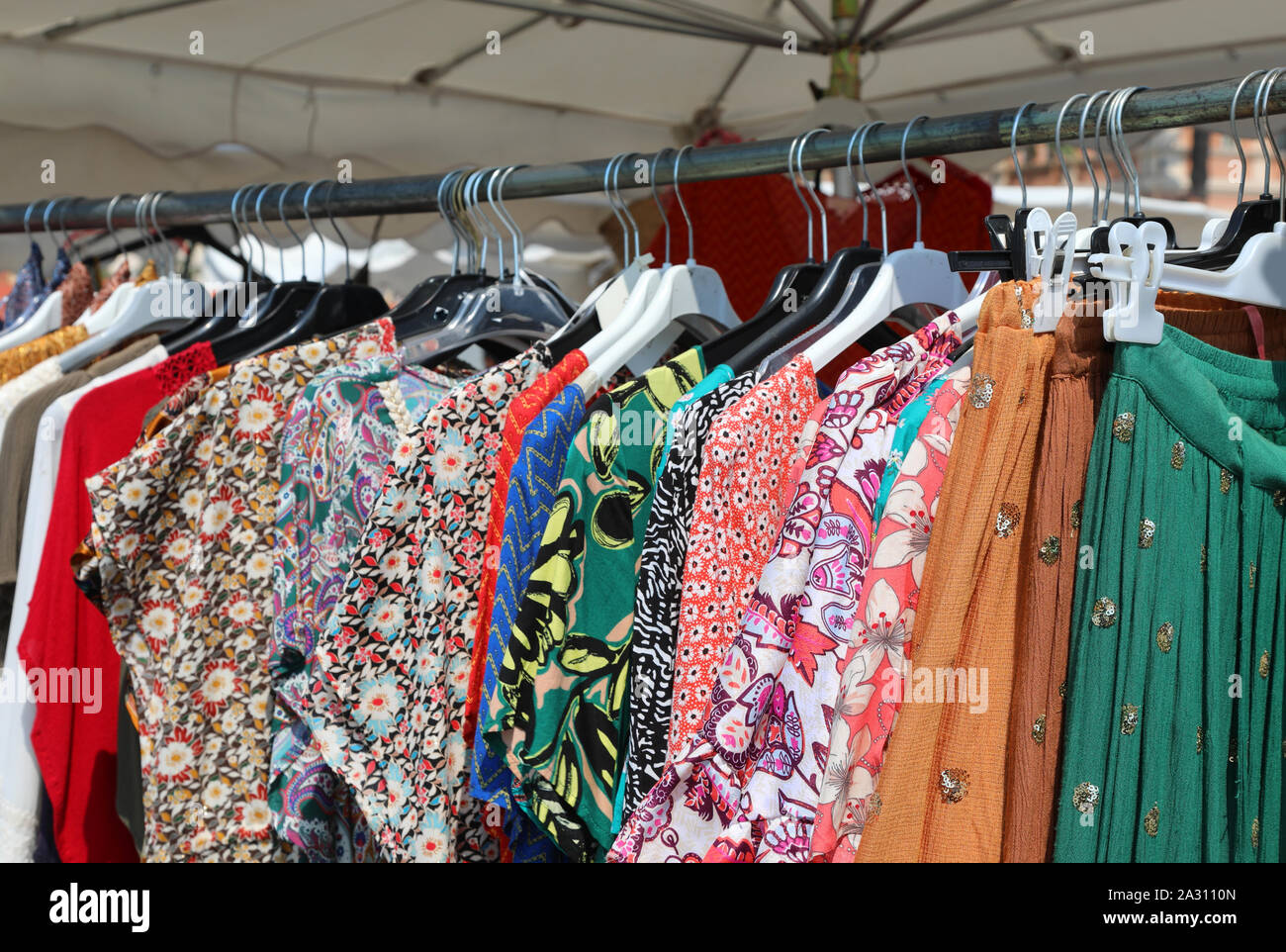 Stand of flea market with vintage and used clothes Stock Photo - Alamy