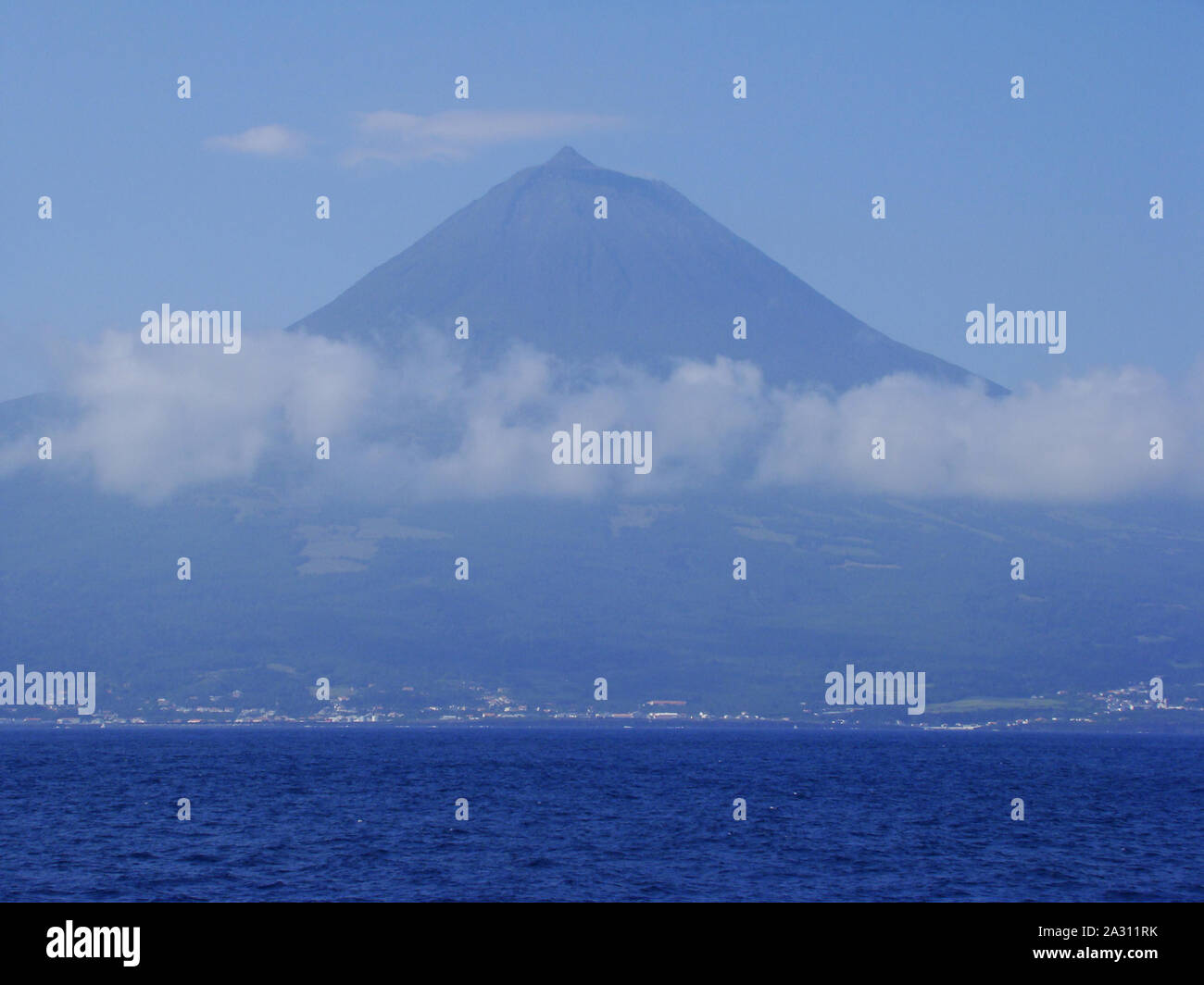 Pico volcano, rising directly from the sea in the Azores archipelago ...