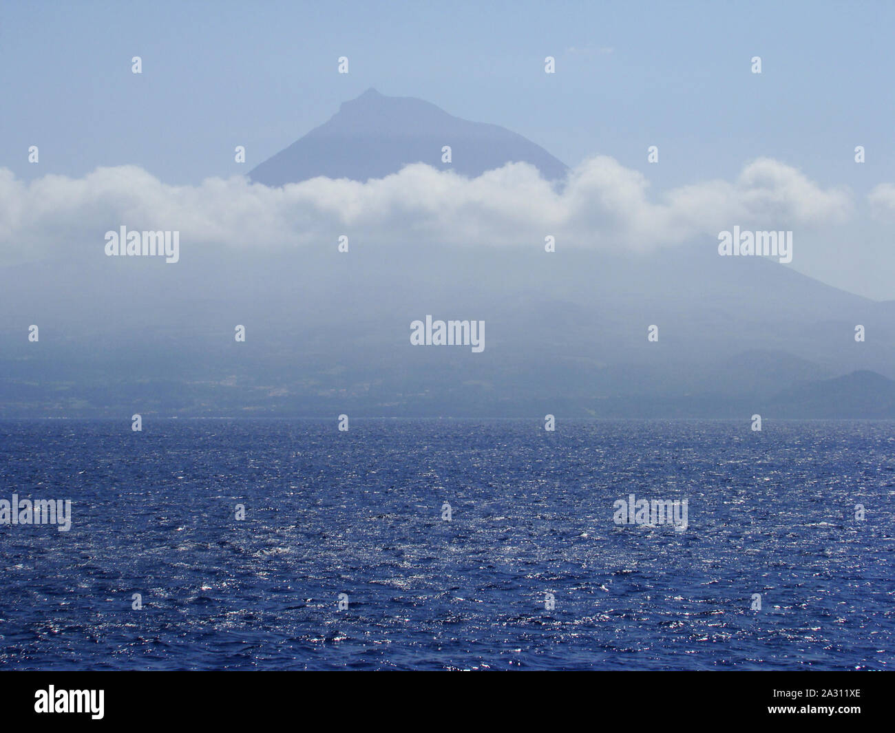 Pico volcano, rising directly from the sea in the Azores archipelago ...