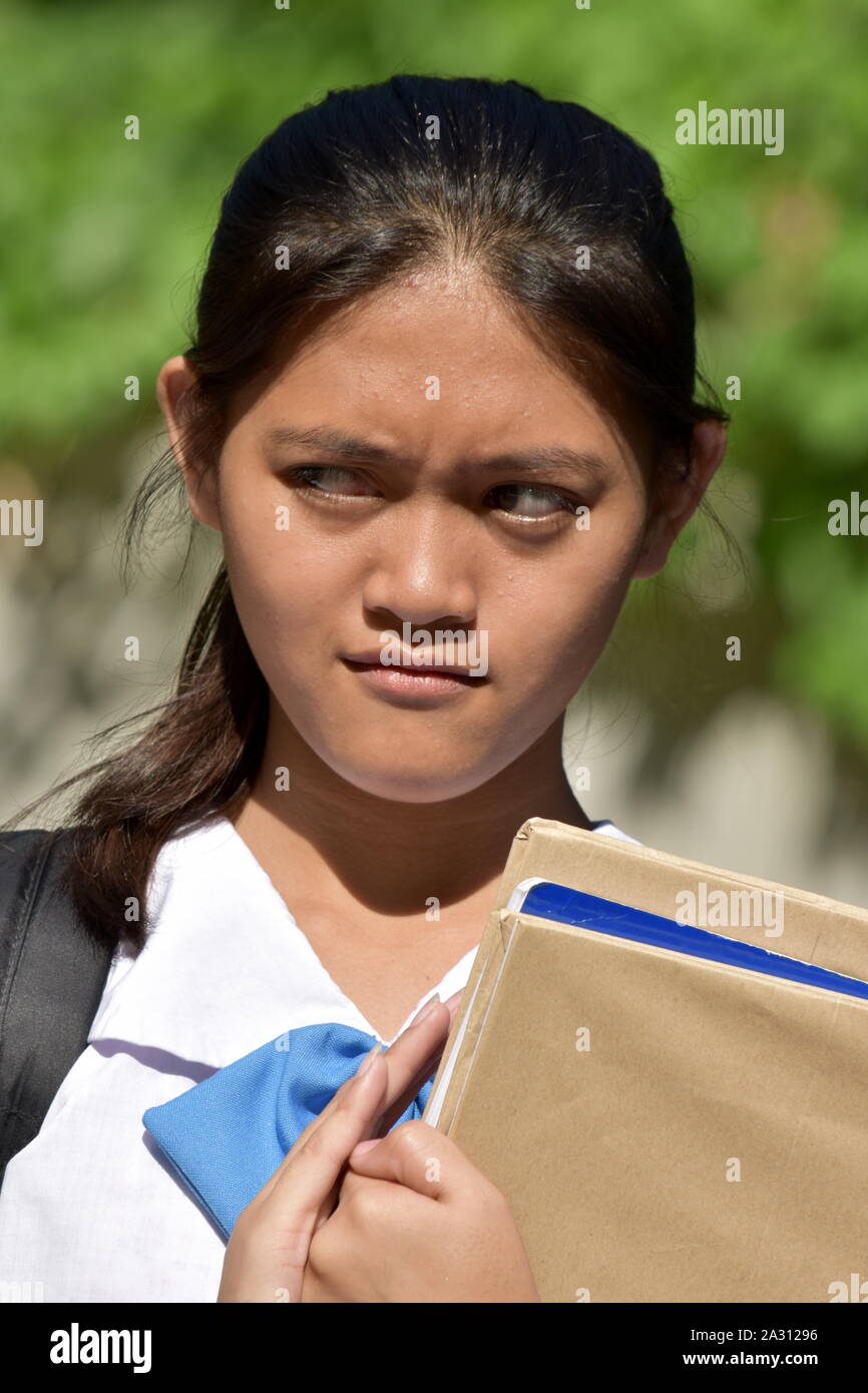 A Confused Youthful Asian Female Student Stock Photo - Alamy