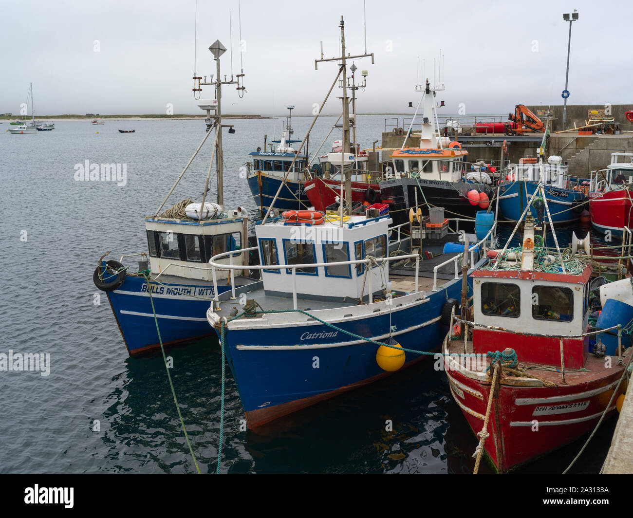 Boats moored at harbor, Mullet Peninsula, Belmullet, Erris, County Mayo ...