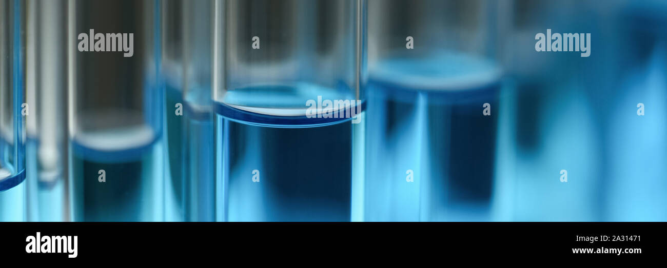 Test tube of glass overflows liquid solution potassium Stock Photo - Alamy