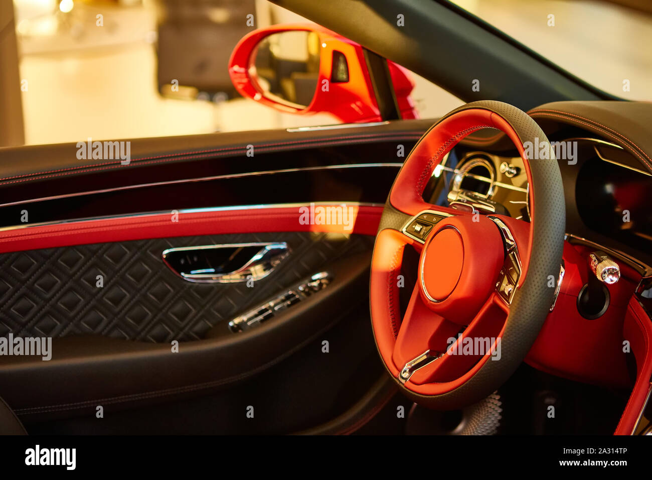 Red luxury car Interior. Steering wheel, shift lever and dashboard ...