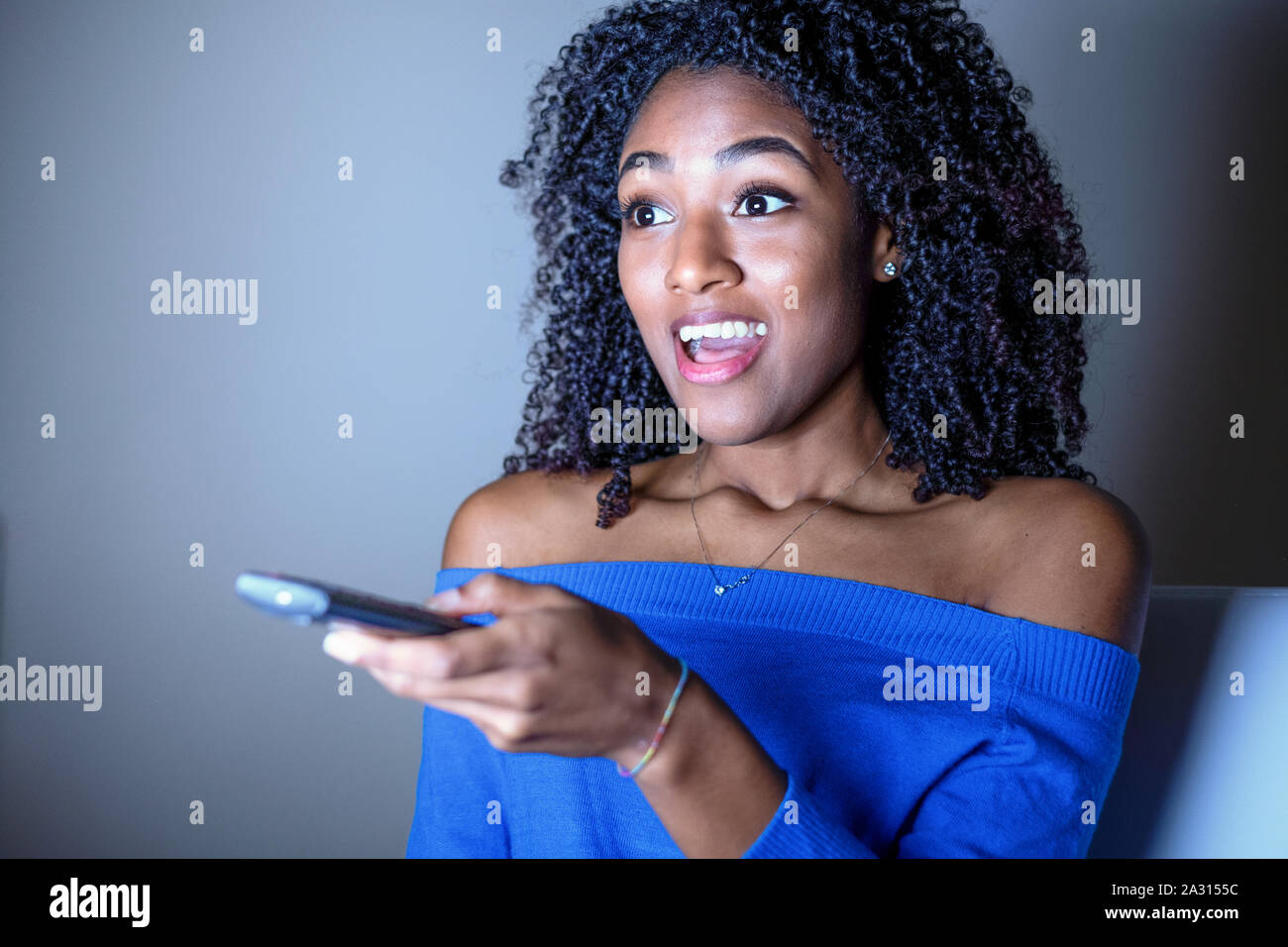 Scared woman at home hi-res stock photography and images - Alamy