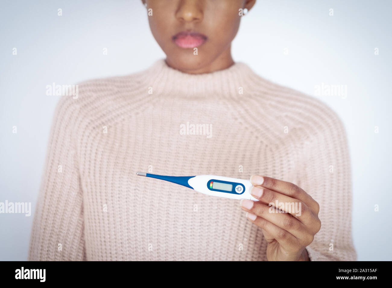 Black female thermometer hi-res stock photography and images - Alamy