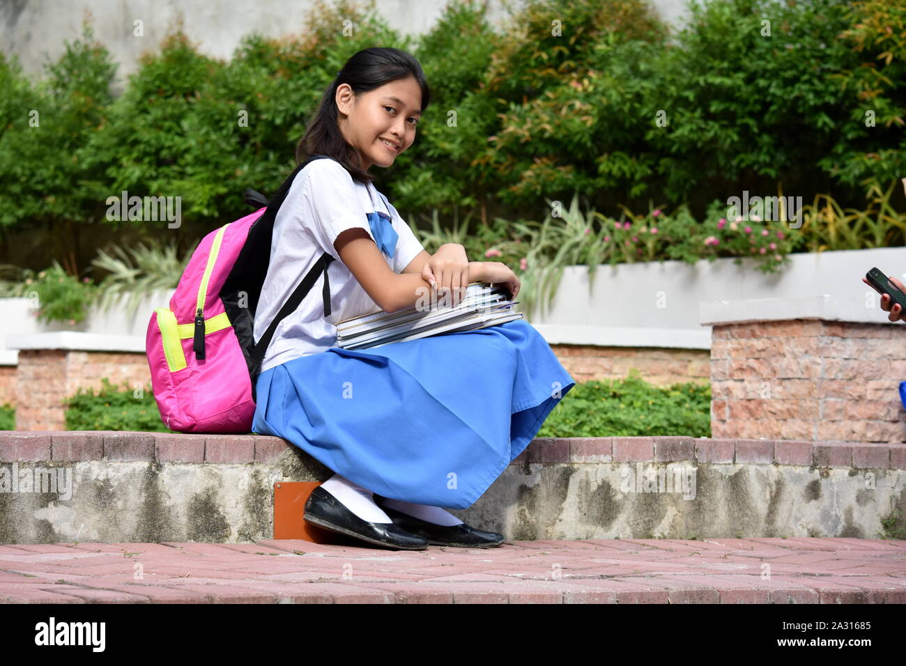 A Young Filipina Girl Student Relaxing Stock Photo - Alamy