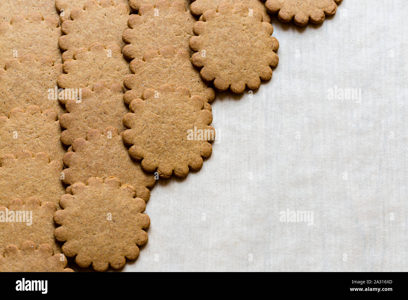 Yummy Ginger cookies on baking paper, traditional Christmas treat ...