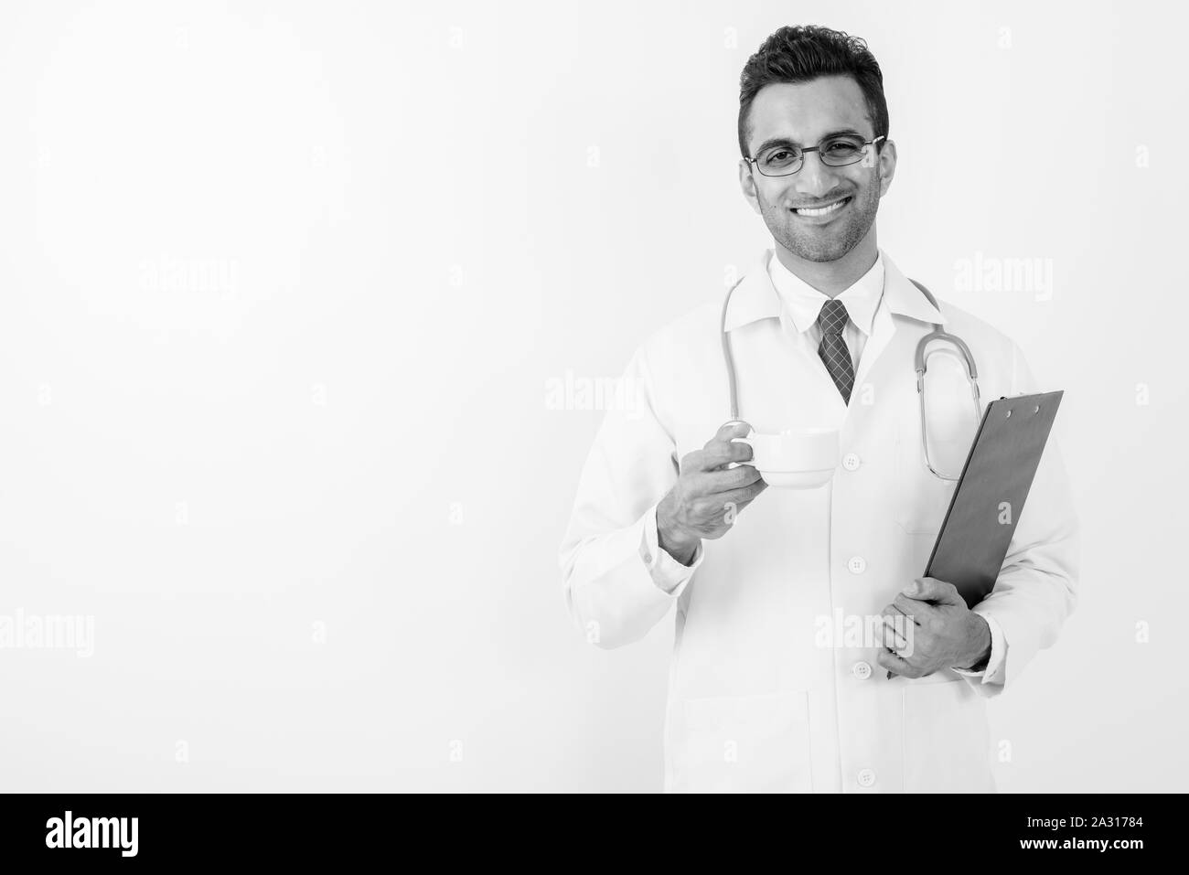 Young man beard holding glasses Black and White Stock Photos & Images ...