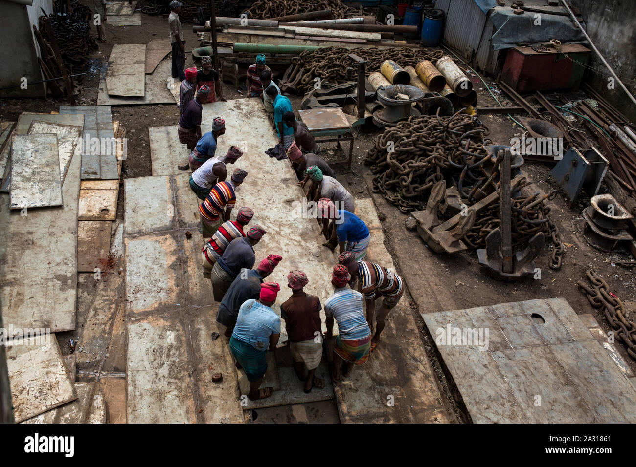 DHAKA, BANGLADESH - OCTOBER 04 : Bangladeshi labourer work in a ...