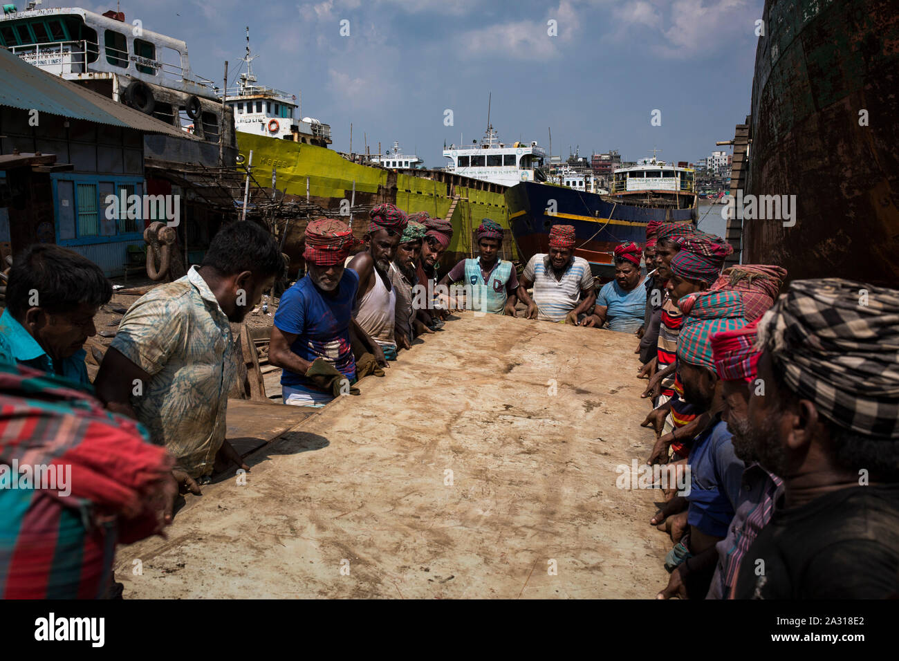 DHAKA, BANGLADESH - OCTOBER 04 : Bangladeshi labourer work in a ...