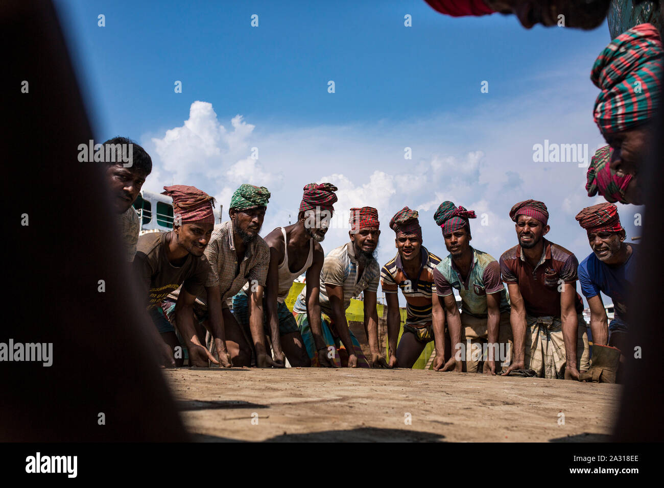 DHAKA, BANGLADESH - OCTOBER 04 : Bangladeshi labourer work in a ...