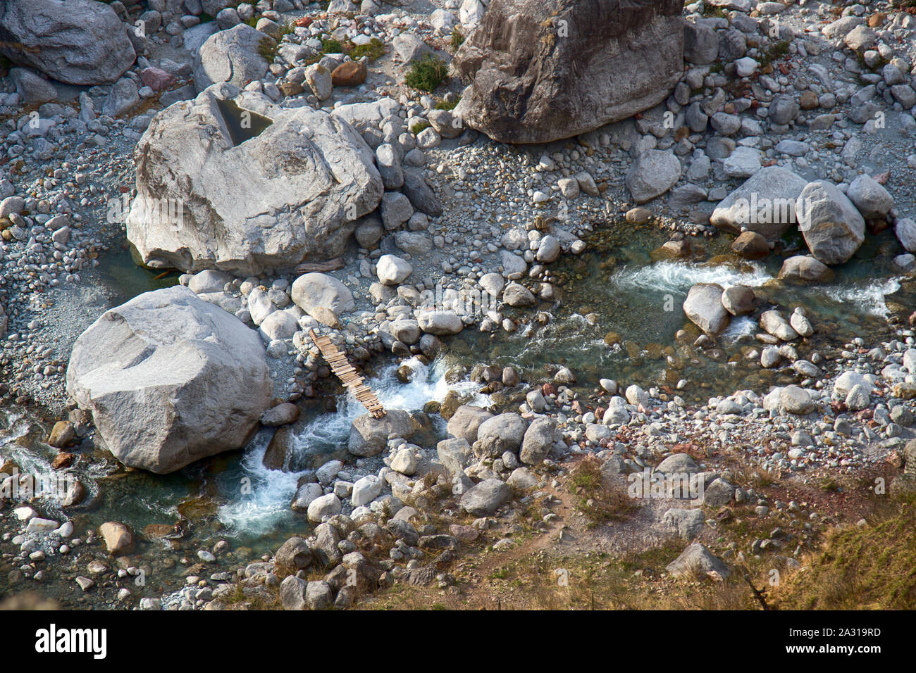 Indomitable mountain river during the winter lowland and a small ...
