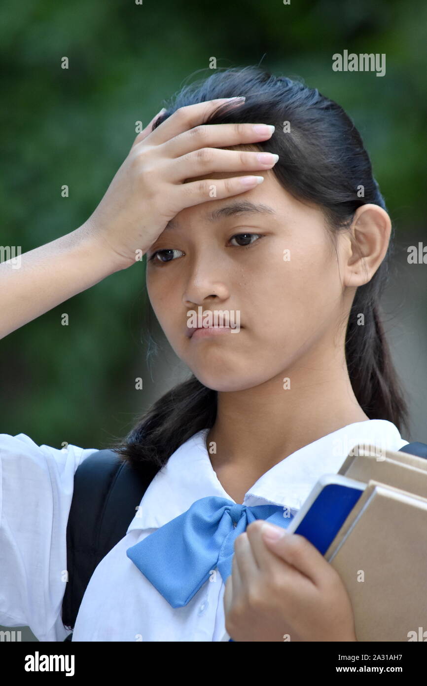 An Asian Girl Student Memory Problems Stock Photo - Alamy