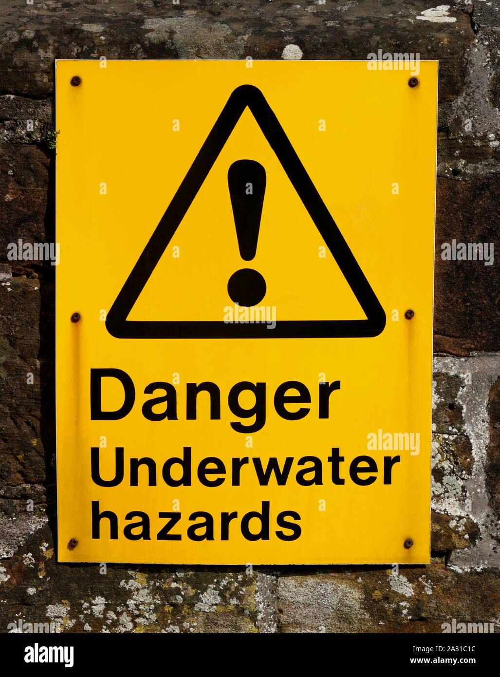 Underwater hazards warning sign at a river estuary Stock Photo - Alamy
