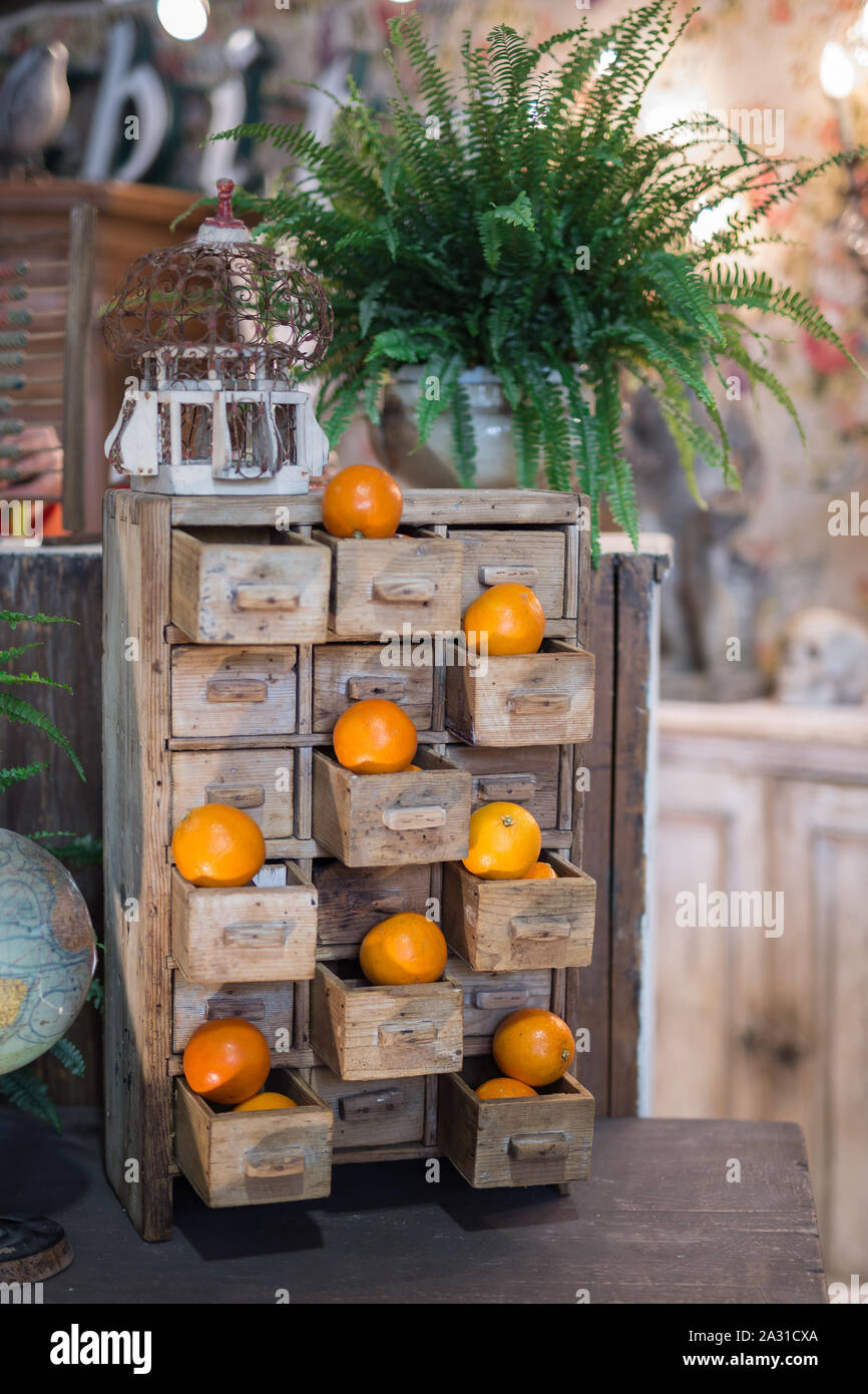 Small Wooden Chest of Drawers with open Drawers and Orange Fruits ...