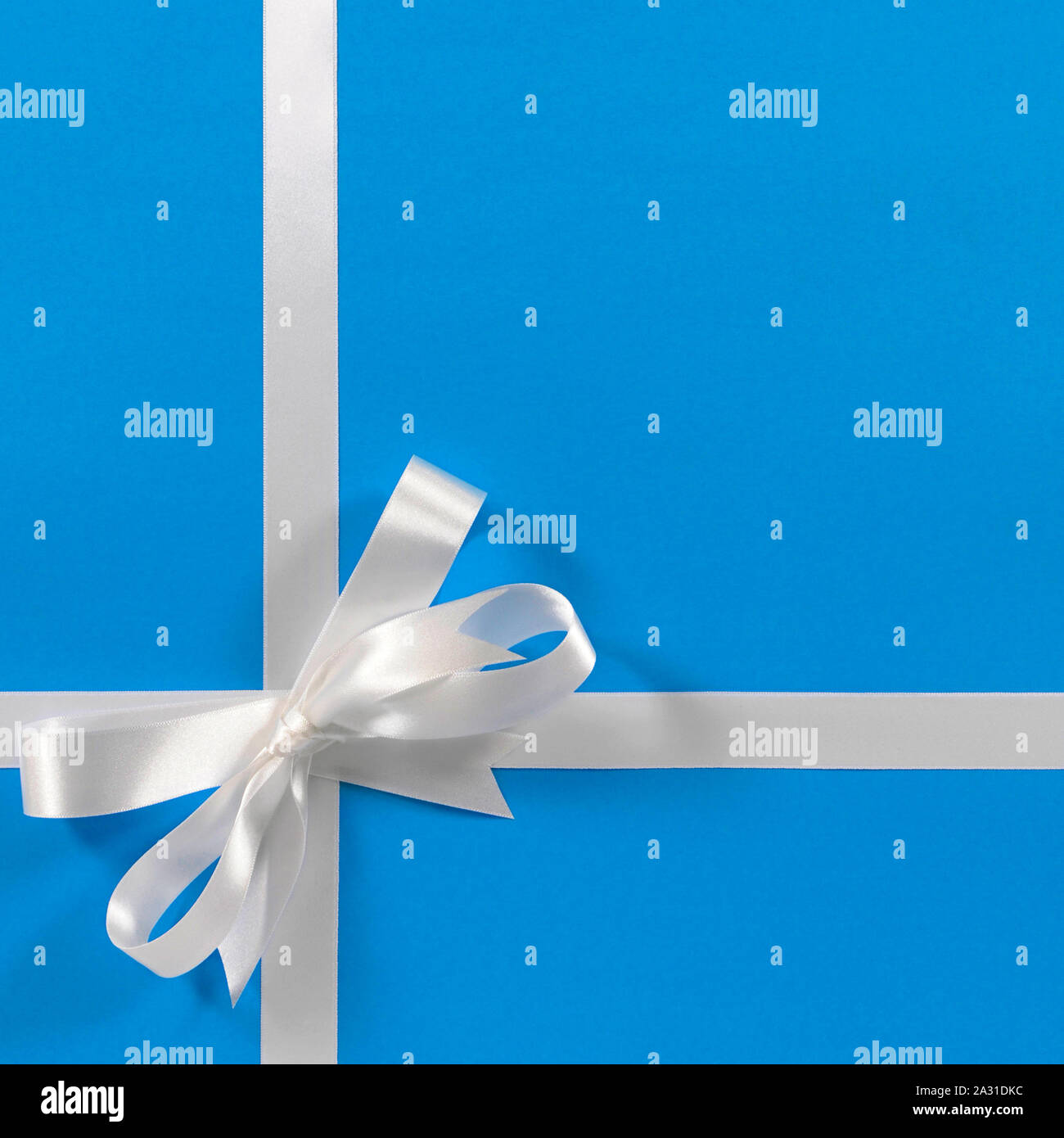Christmas gift border white gift ribbon bow blue background vertical ...