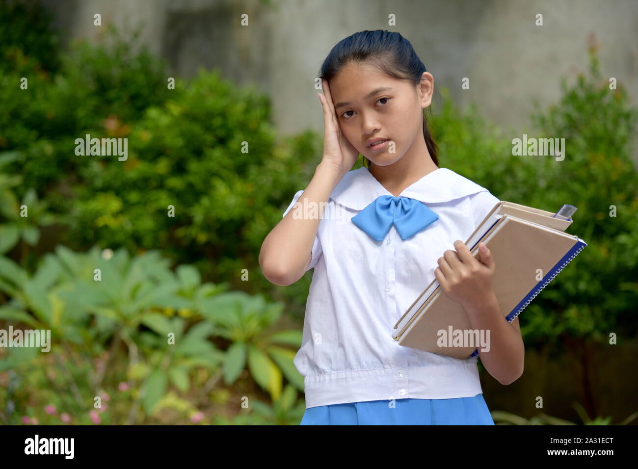 A Tired Pretty Filipina Female Student Stock Photo - Alamy