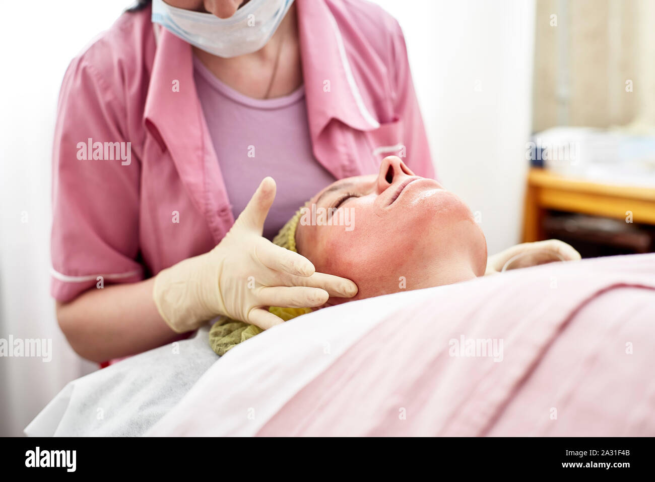 Professional - beautician puts on the skin for the chemical peeling ...