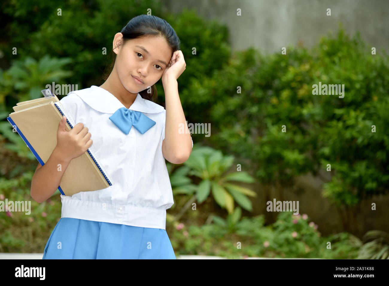 Female Student Making A Decision With School Books Stock Photo - Alamy