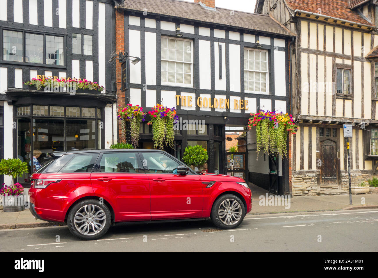 Red Land Rover Range Rover parked on the Street road outside ...