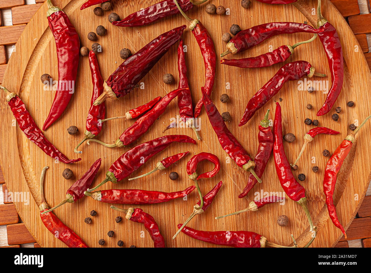 Red chili peppers on a wooden board Stock Photo - Alamy