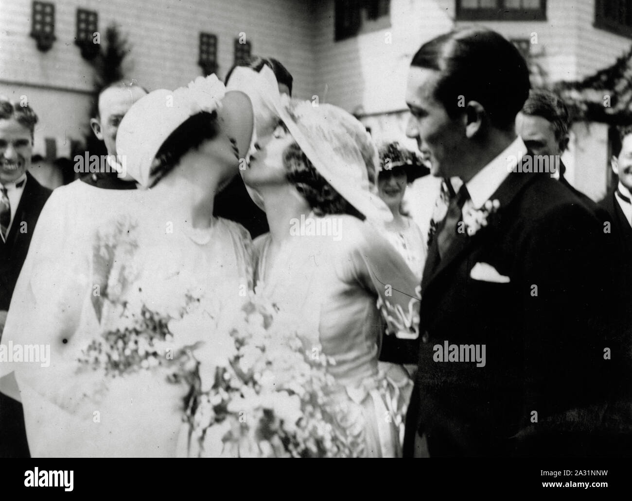Marilyn Miller kissing Mary Pickford, at the wedding to her brother ...