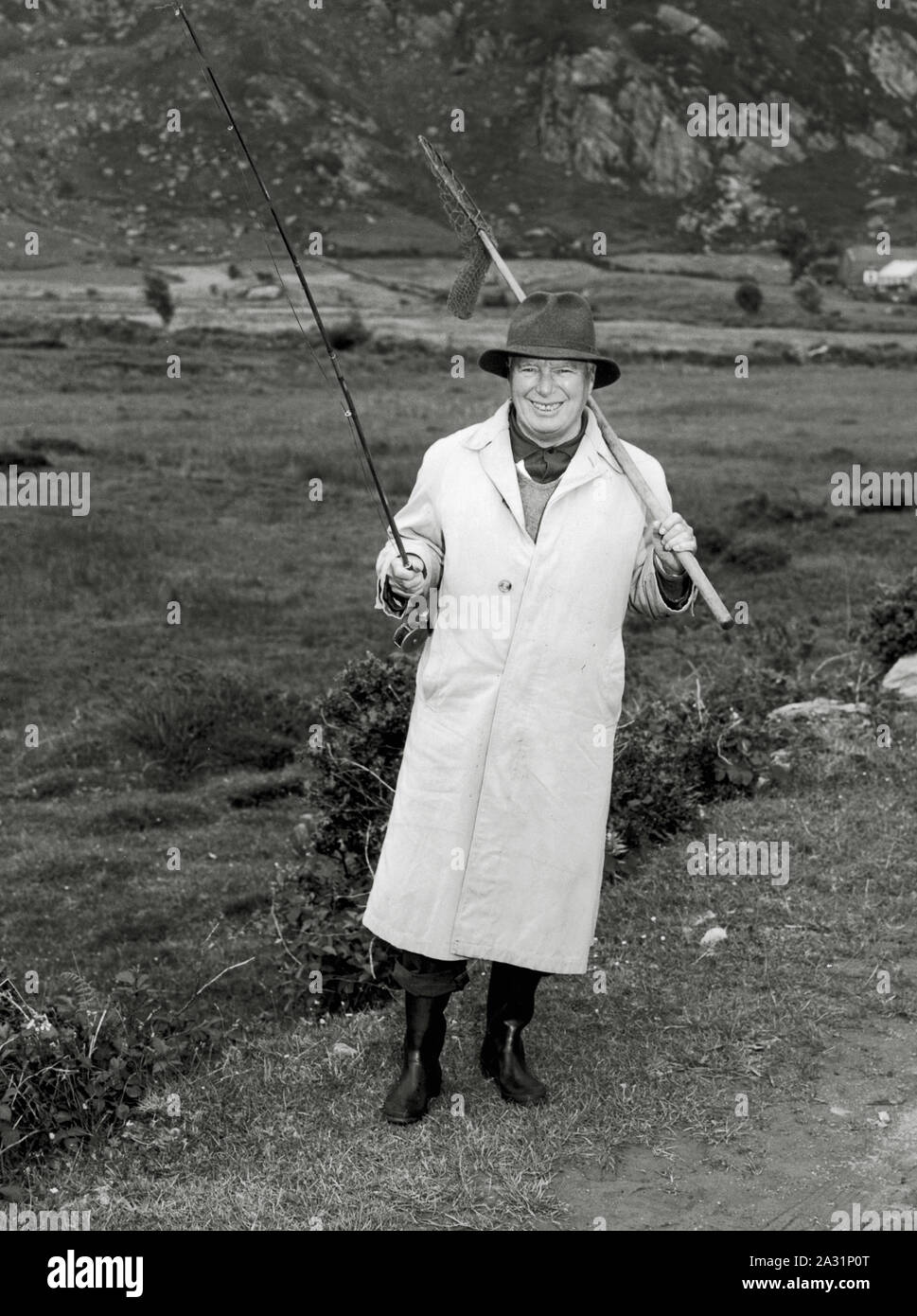 Charles Chaplin goes fishing while vacationing in Killarney, Ireland ...