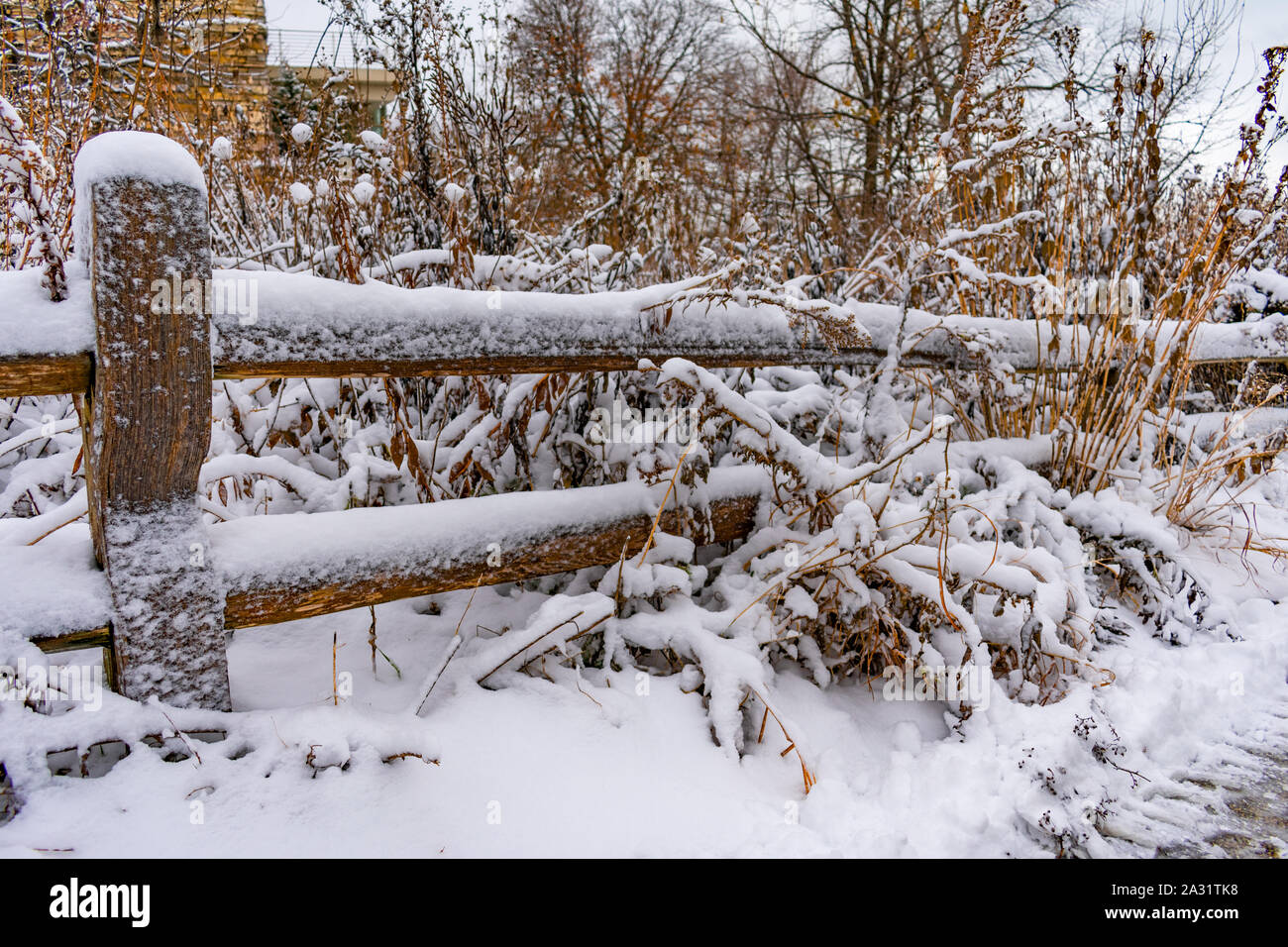 Freshly Fallen Snow on a Wood Fence Stock Photo - Alamy