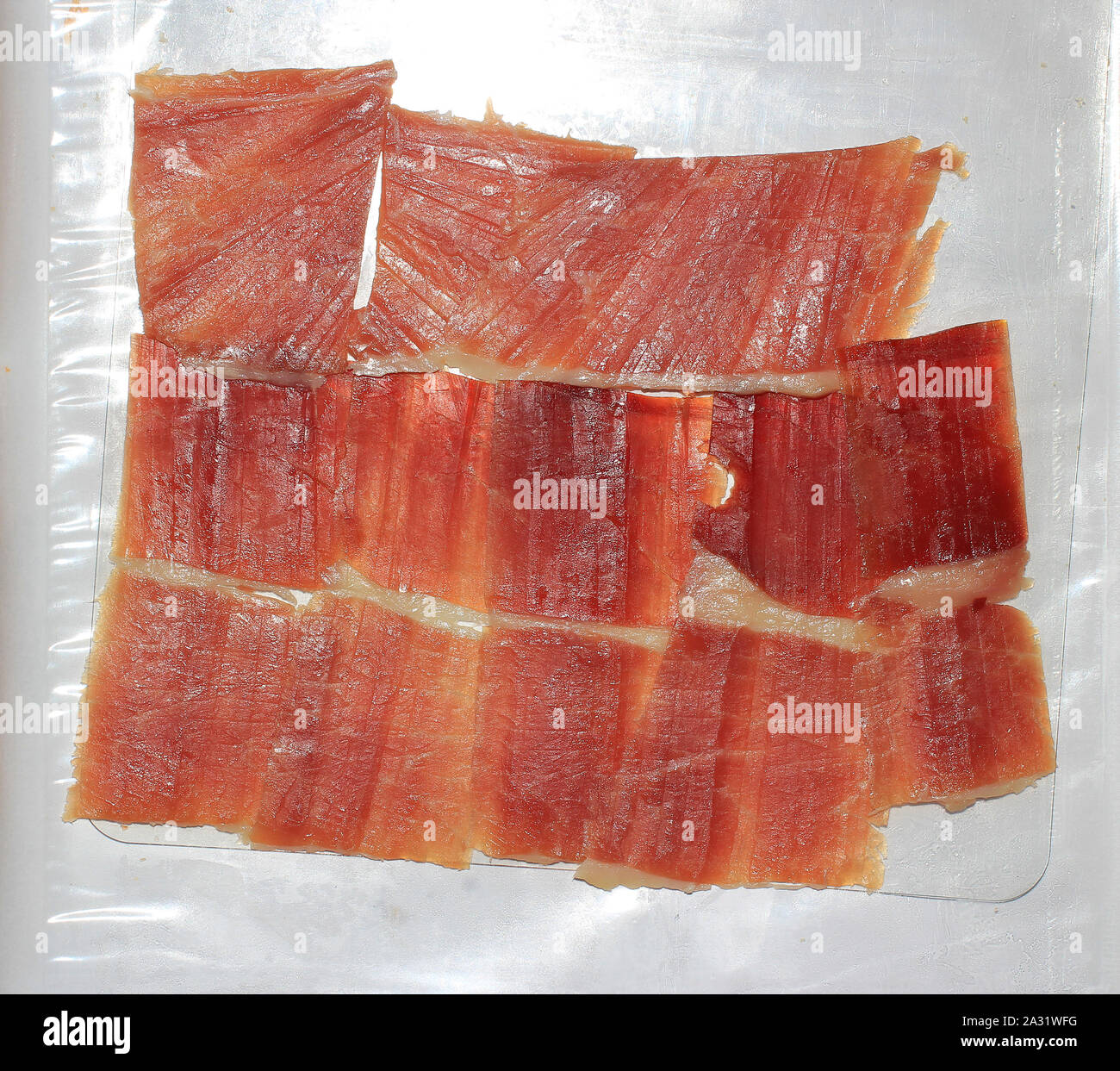 Spanish hamon, hand-sliced on a tray Stock Photo - Alamy